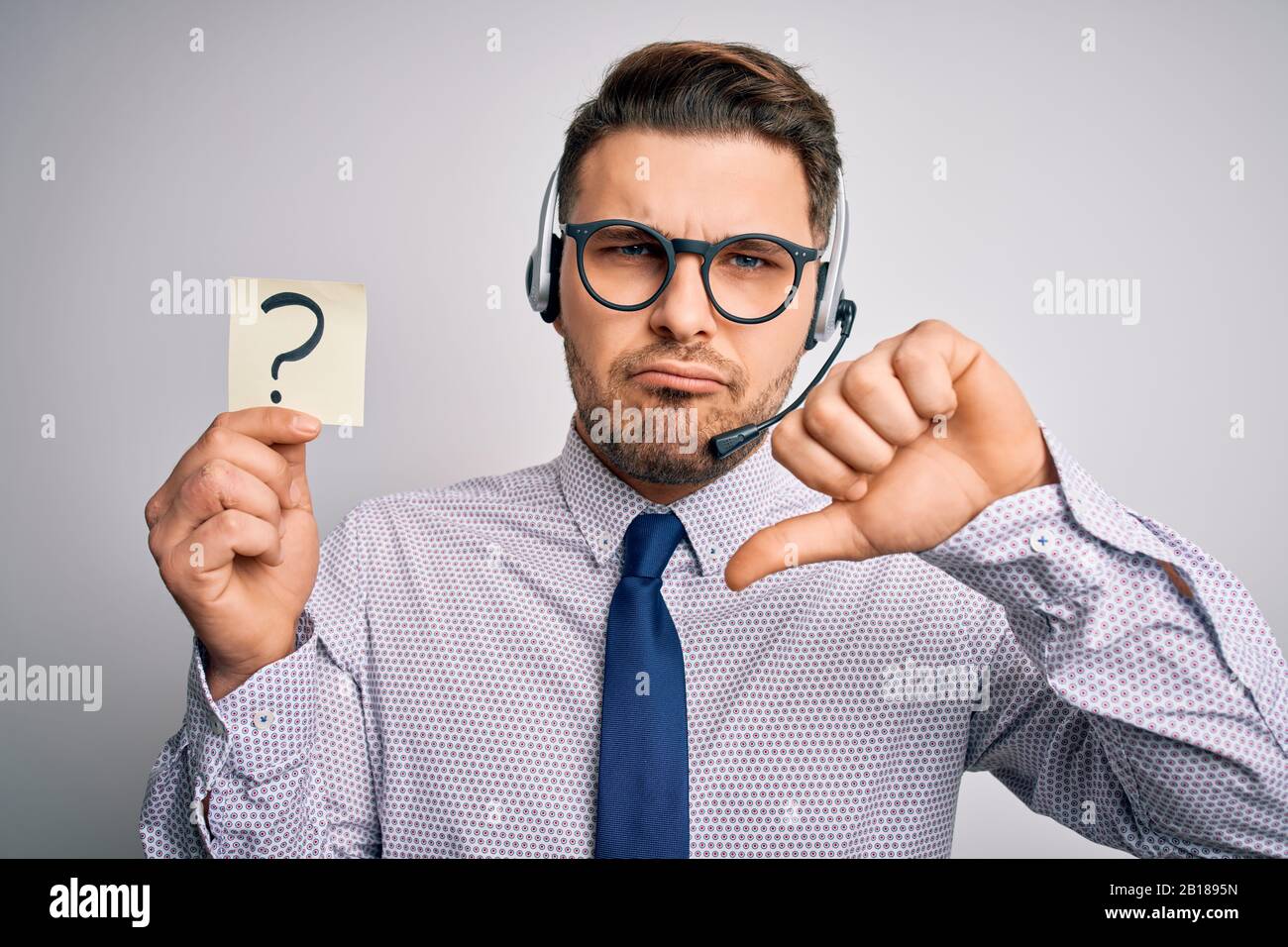 Young call center operator business man with blue eyes holding paper ...