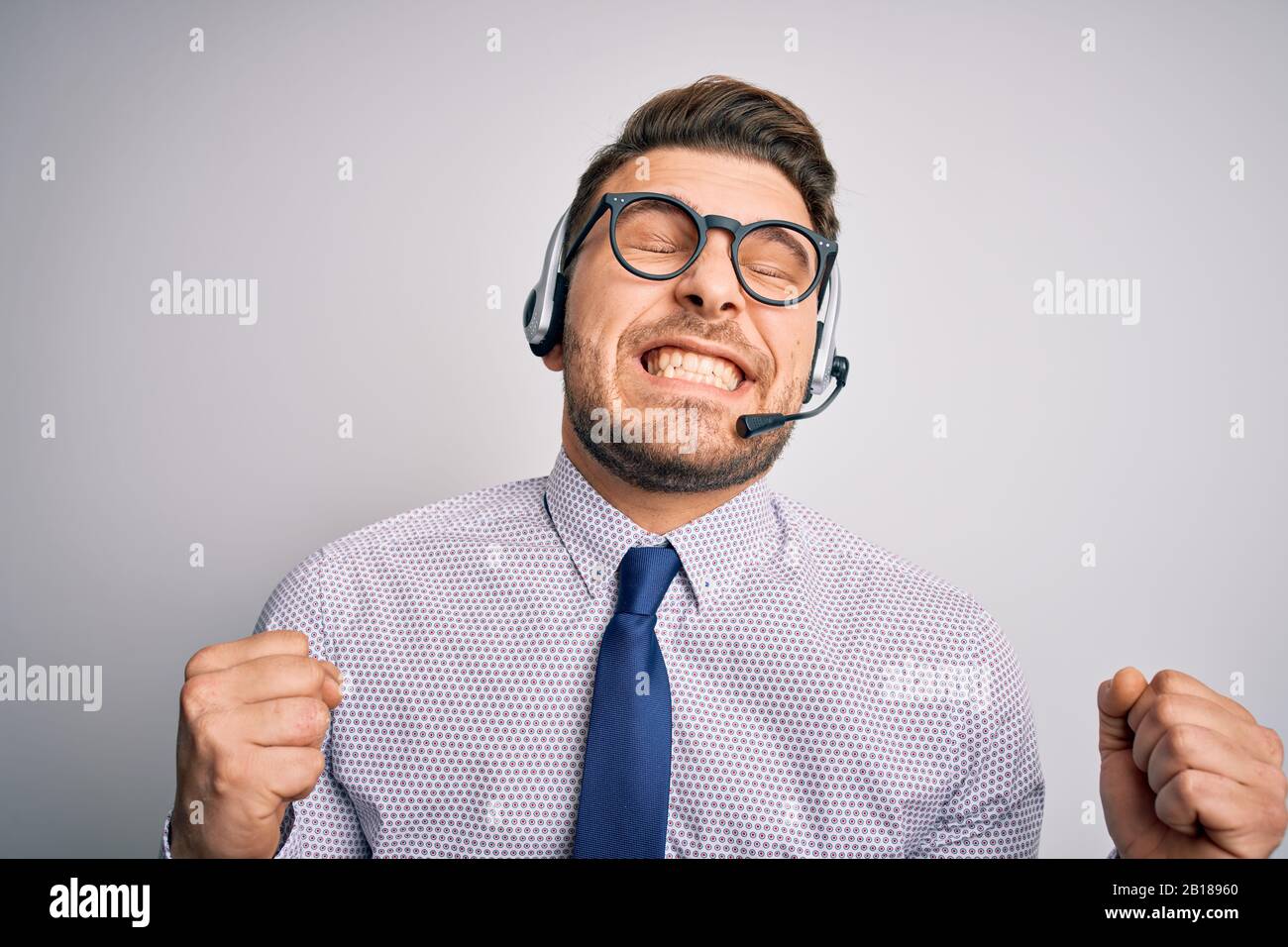 Young call center operator business man with blue eyes wearing glasses ...