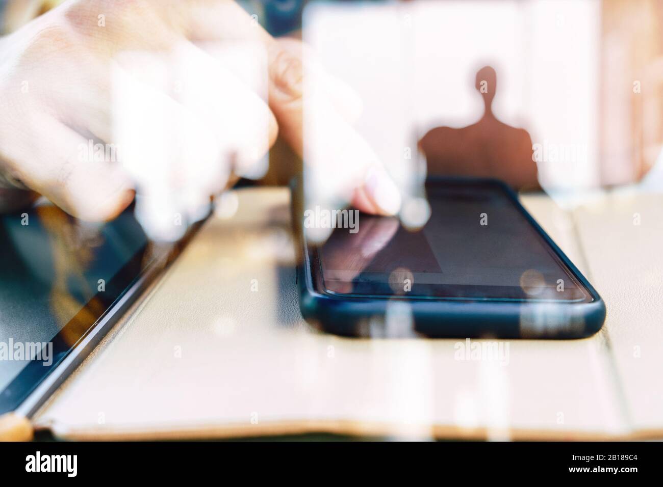 Hands with mobile, double exposure Stock Photo - Alamy