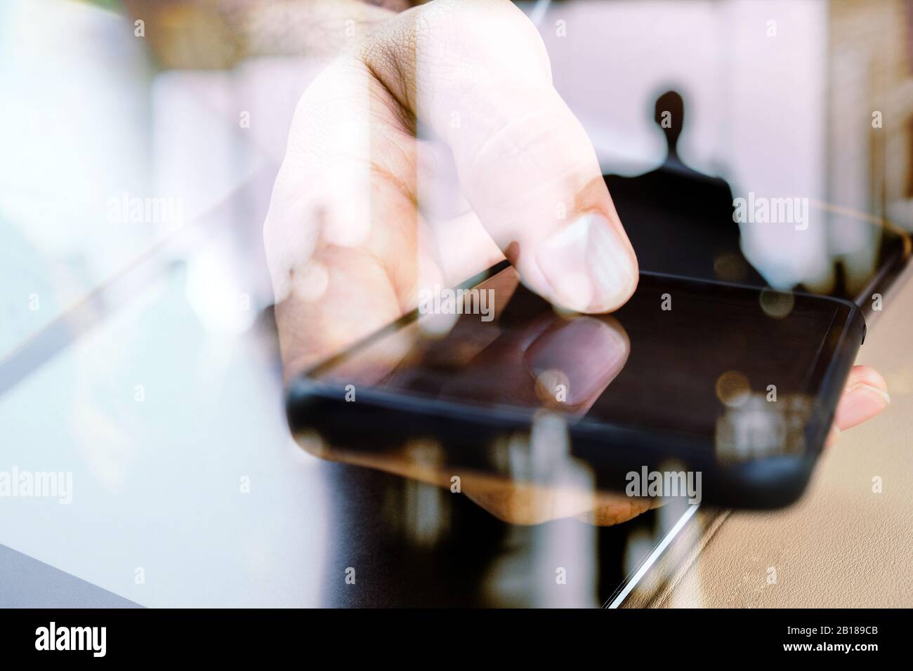 Hands with mobile, double exposure Stock Photo - Alamy