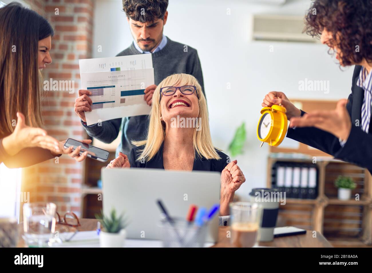 Group of business workers working together. Partners stressing one of ...