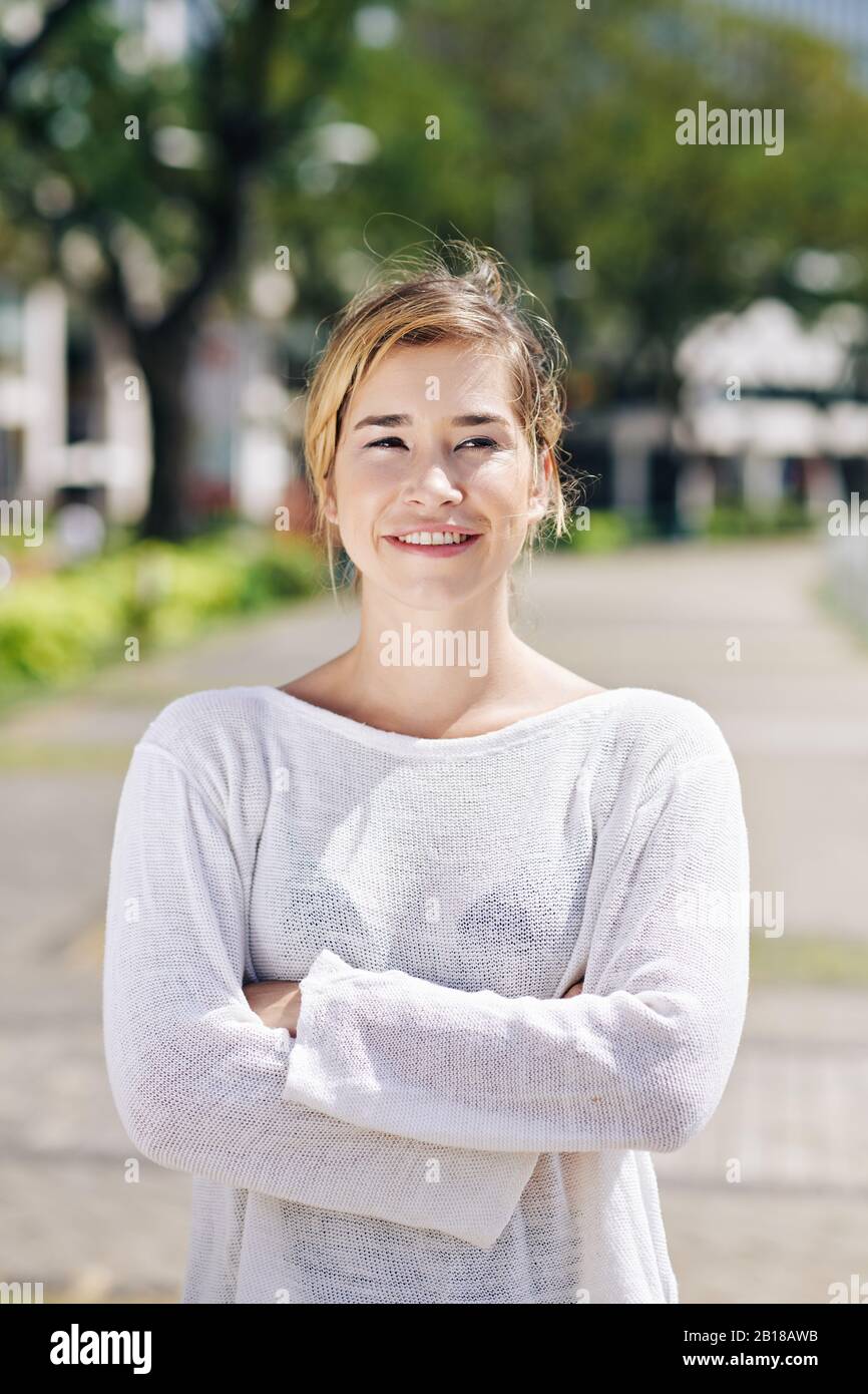 Young woman folding hands hi-res stock photography and images - Alamy