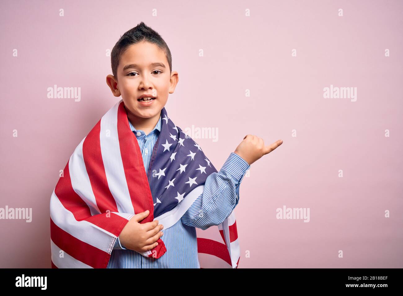 Young little patriotic boy kid covered on united states of america flag ...