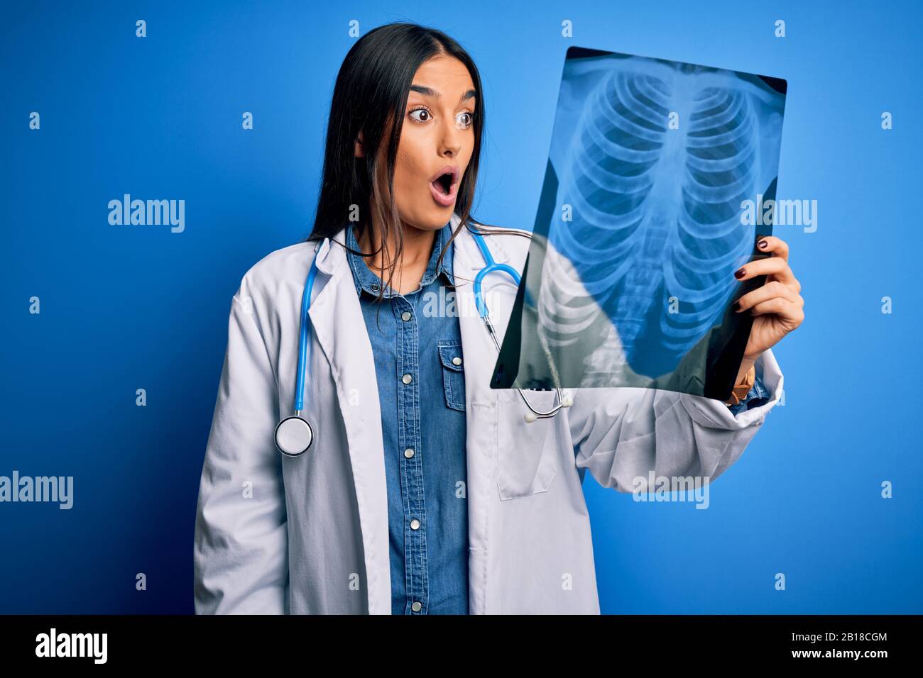 Woman holding chest in fear hi-res stock photography and images - Alamy
