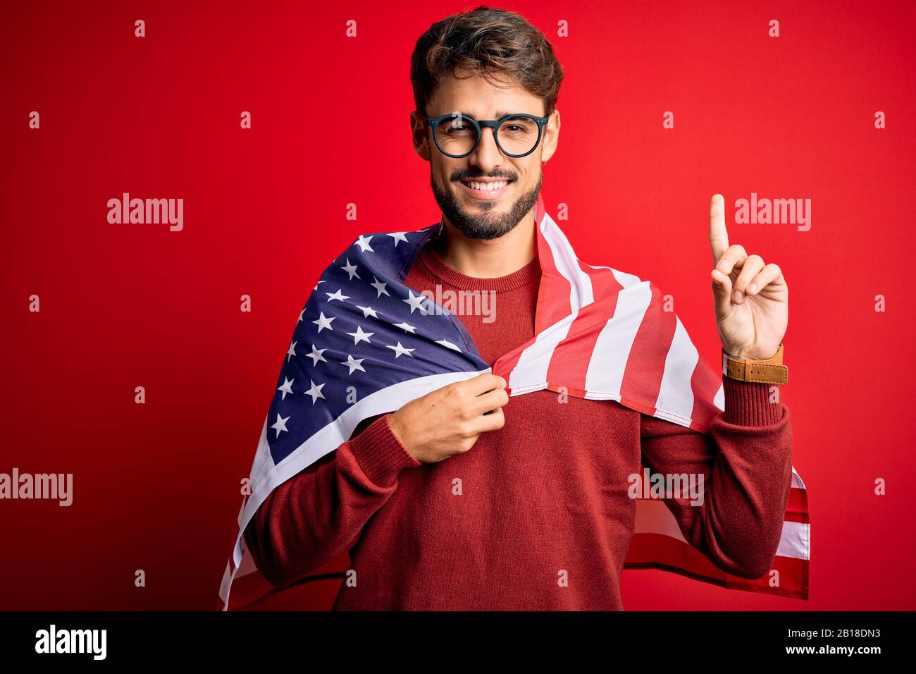 Young Man Wearing Glasses And United States Of America Flag Over
