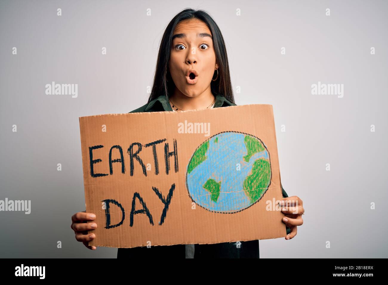 Young beautiful asian woman holding banner asking for earth and ...