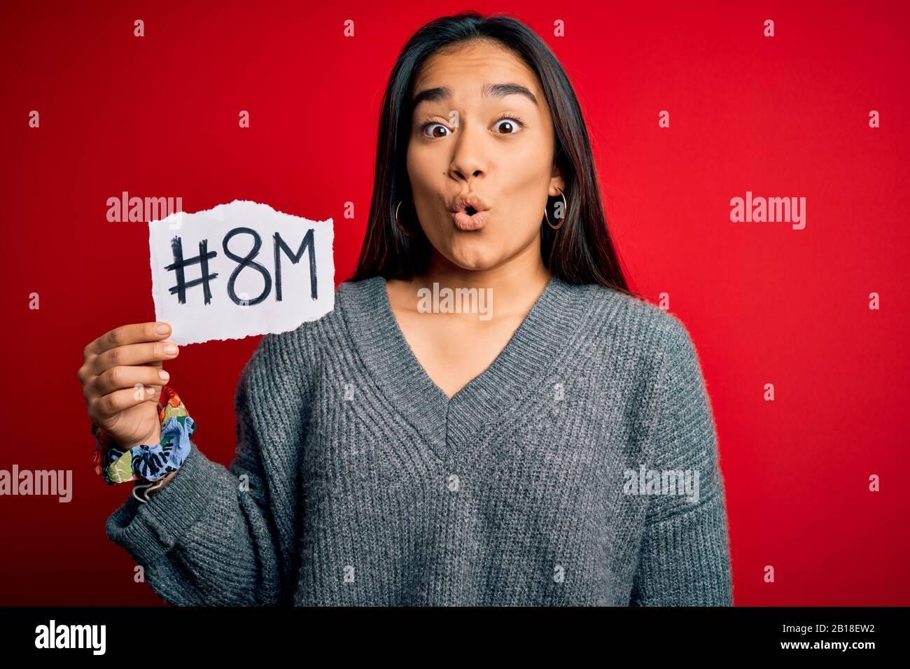 Young beautiful asian woman celebrating 8th march womens day holding ...