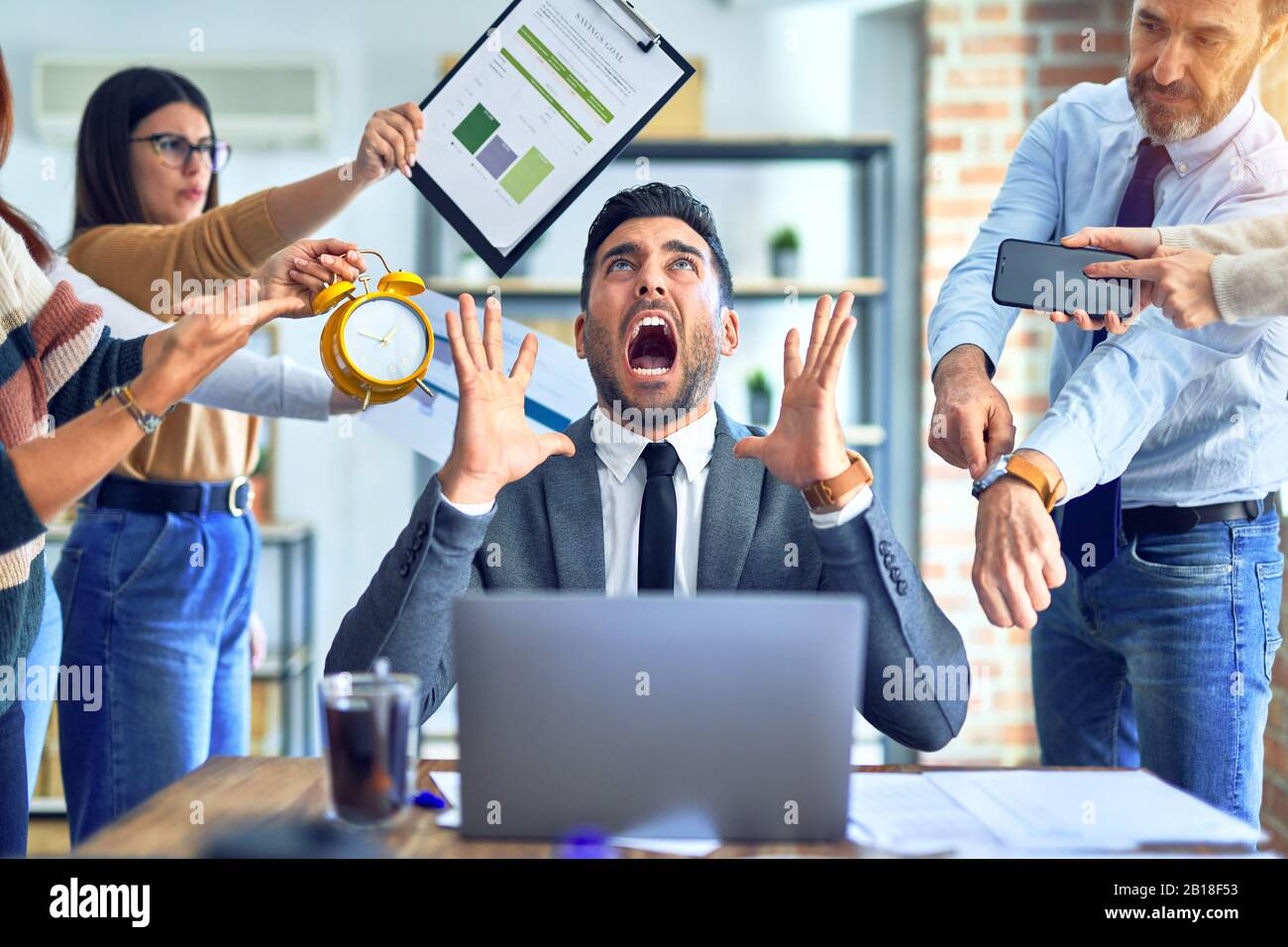 Group of business workers working together. Partners stressing one of ...