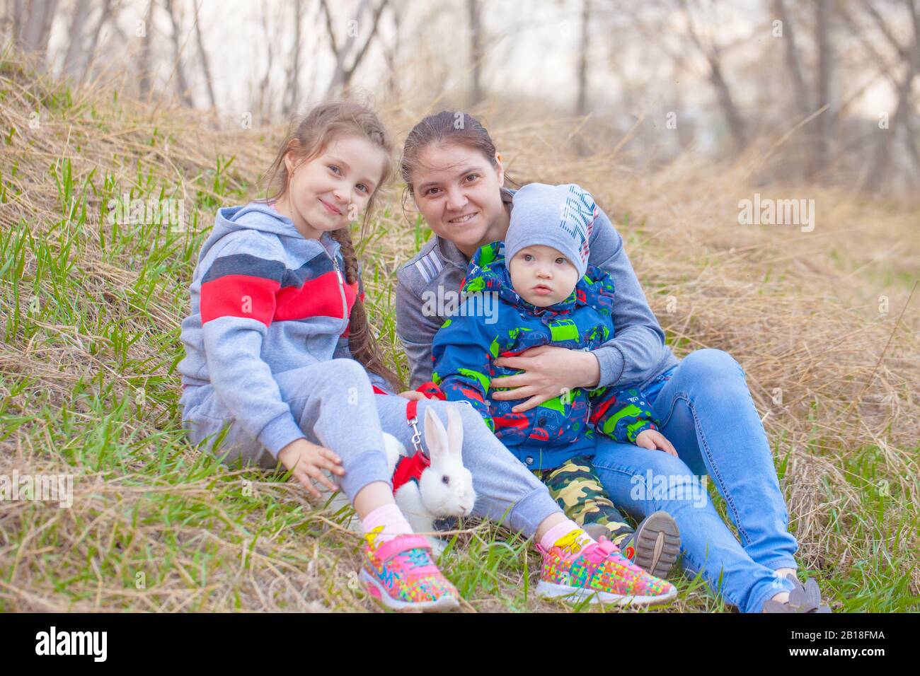Mom with daughter spring lawn. Family holidays in the park Stock Photo ...