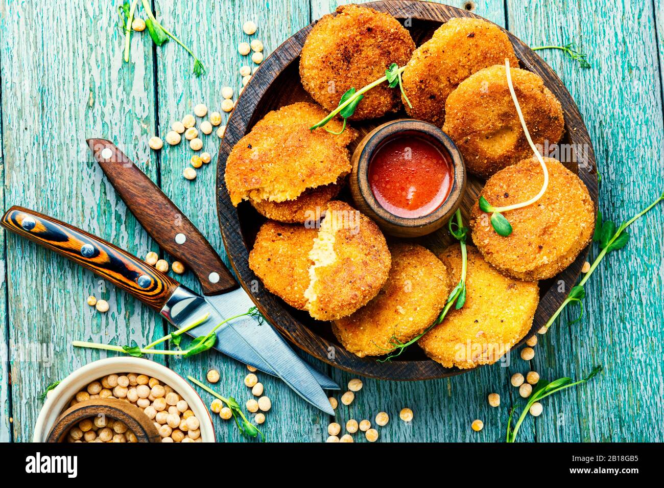 Vegetable diet cutlets made from green peas on wooden table.Homemade ...