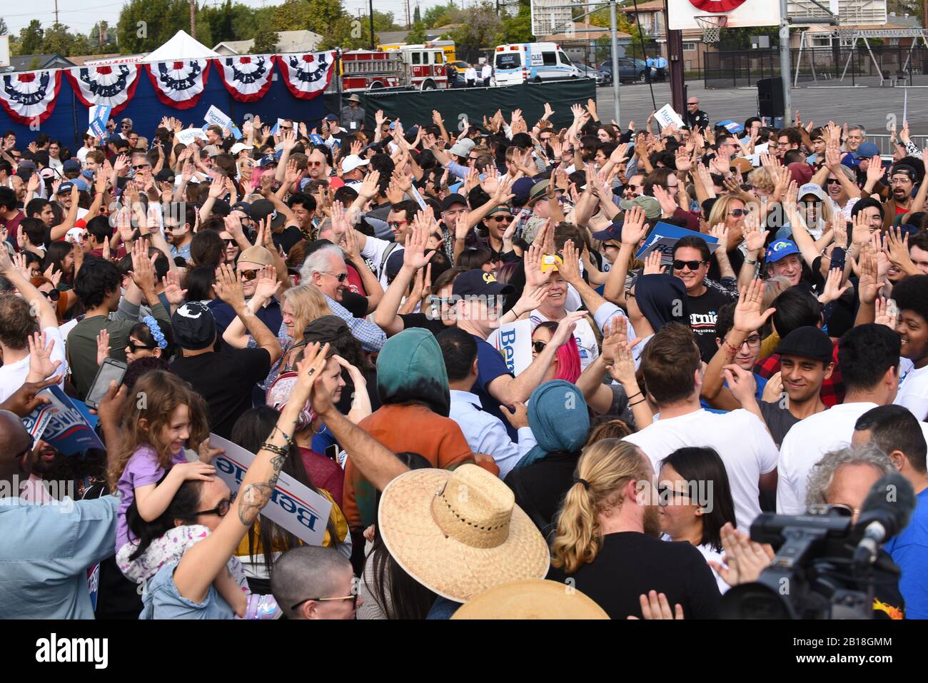 SANTA ANA, CALIFORNIA - 21 FEB 2020: Crowd of supporters high five each ...
