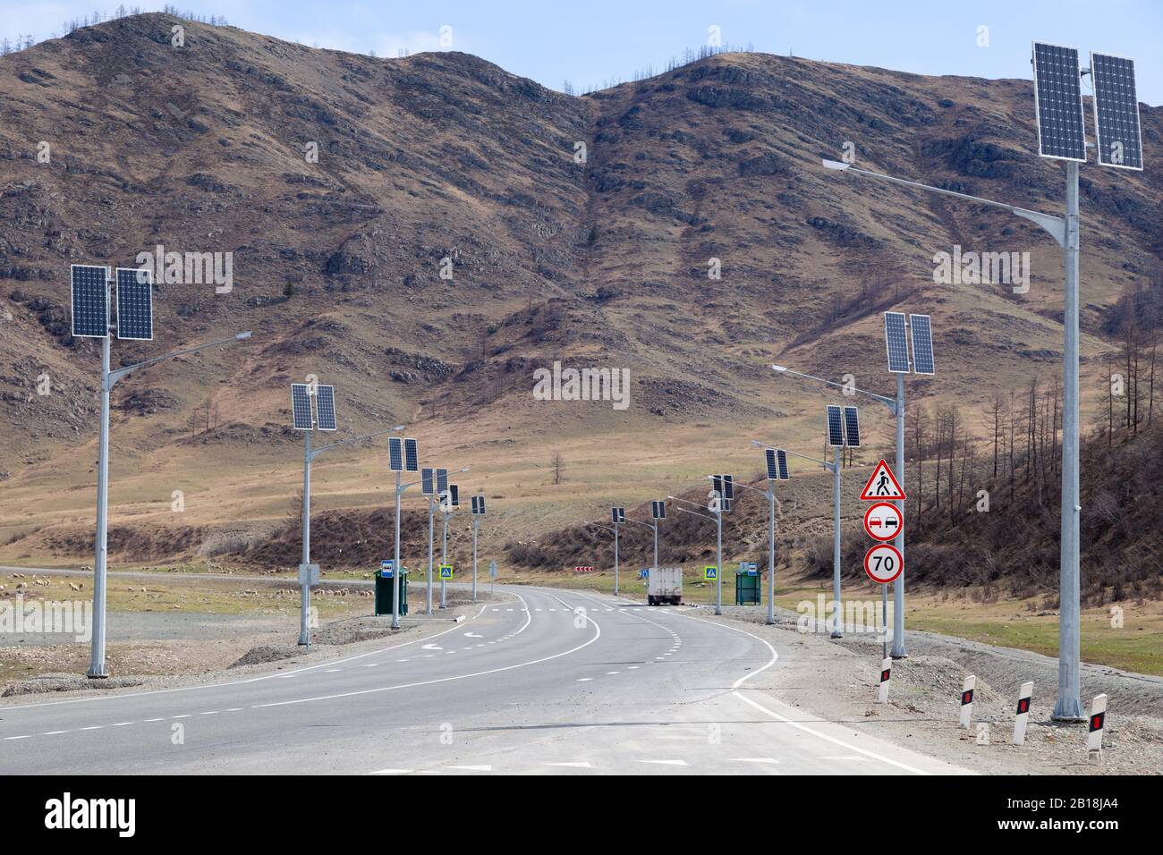 Sun solar power street panel along the road, mountains, ecology ...