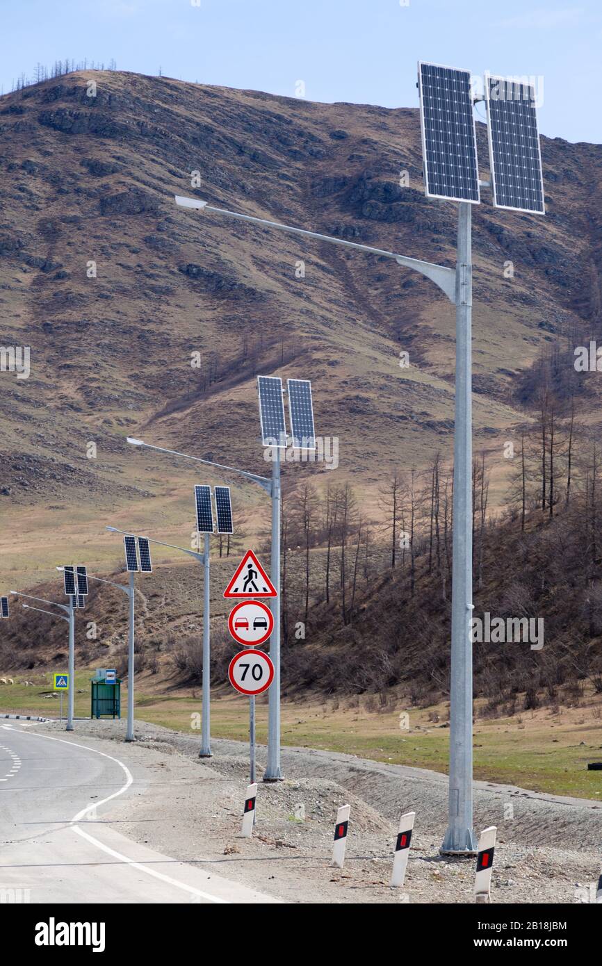 Sun solar power street panel along the road, mountains, ecology ...
