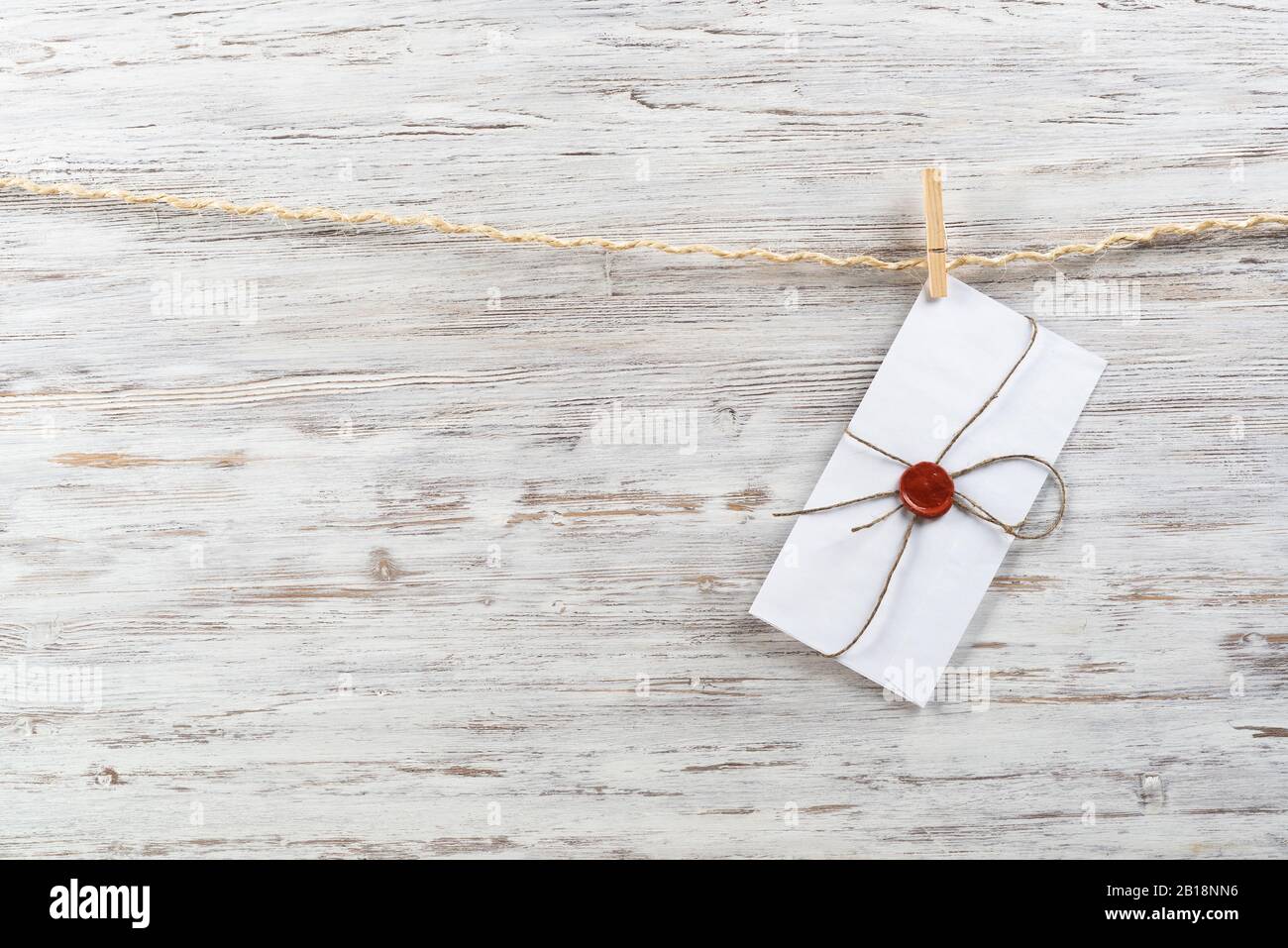 White classic envelope hanging on twine rope Stock Photo - Alamy