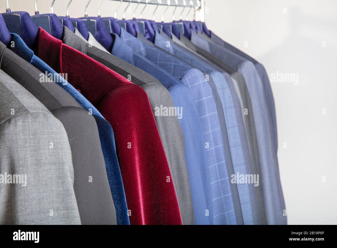 Mens suits on rack hi-res stock photography and images - Alamy