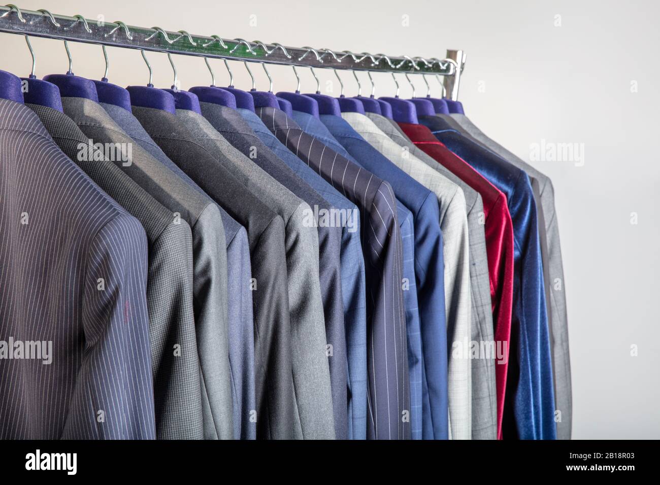 Mens suits on rack hi-res stock photography and images - Alamy