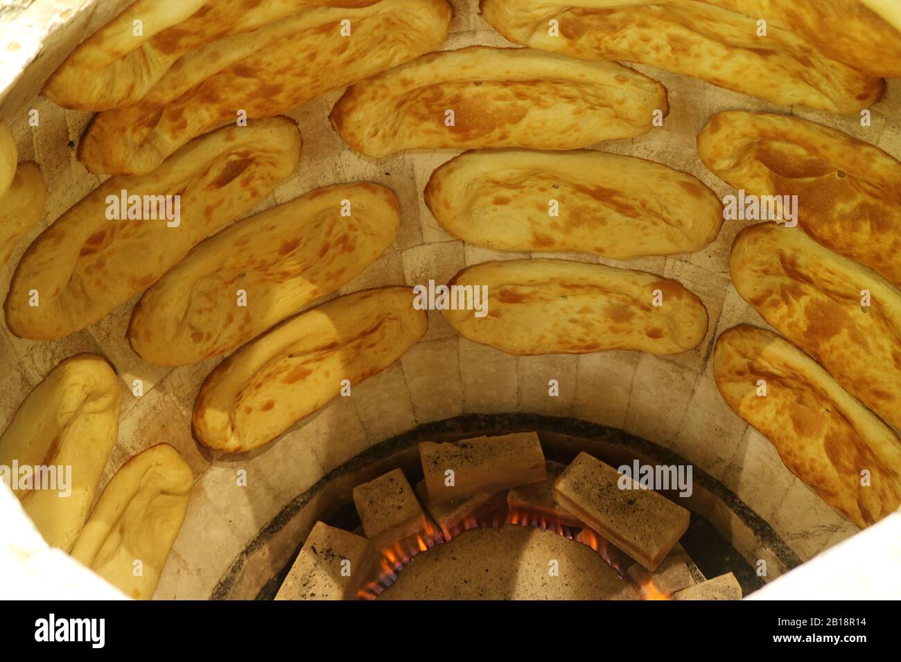 Many of Armenian traditional breads baked in a modern gas tonir oven ...