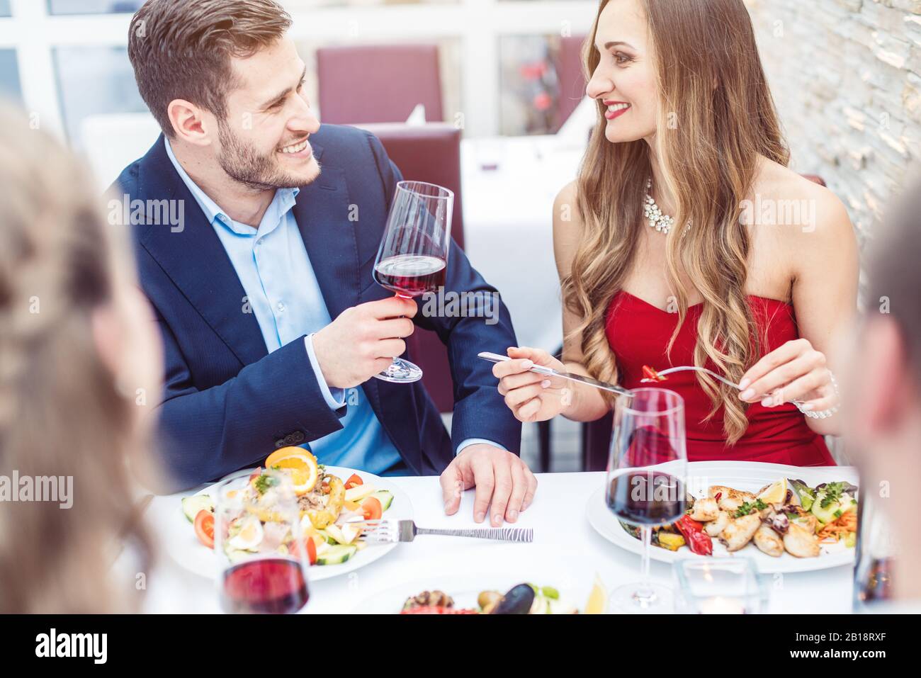 People in an Italian restaurant drinking wine and eating pasta Stock ...