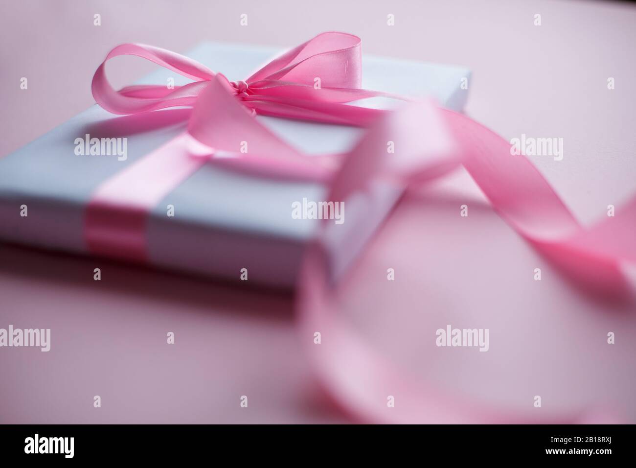 Decorative white gift box with pink bow and long beautiful ribbon Stock ...