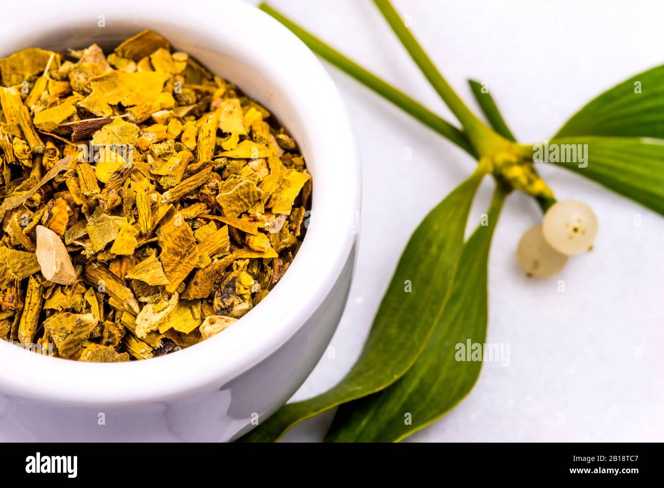 mistletoe, medicinal herb dried and fresh leaves with mortar Stock ...
