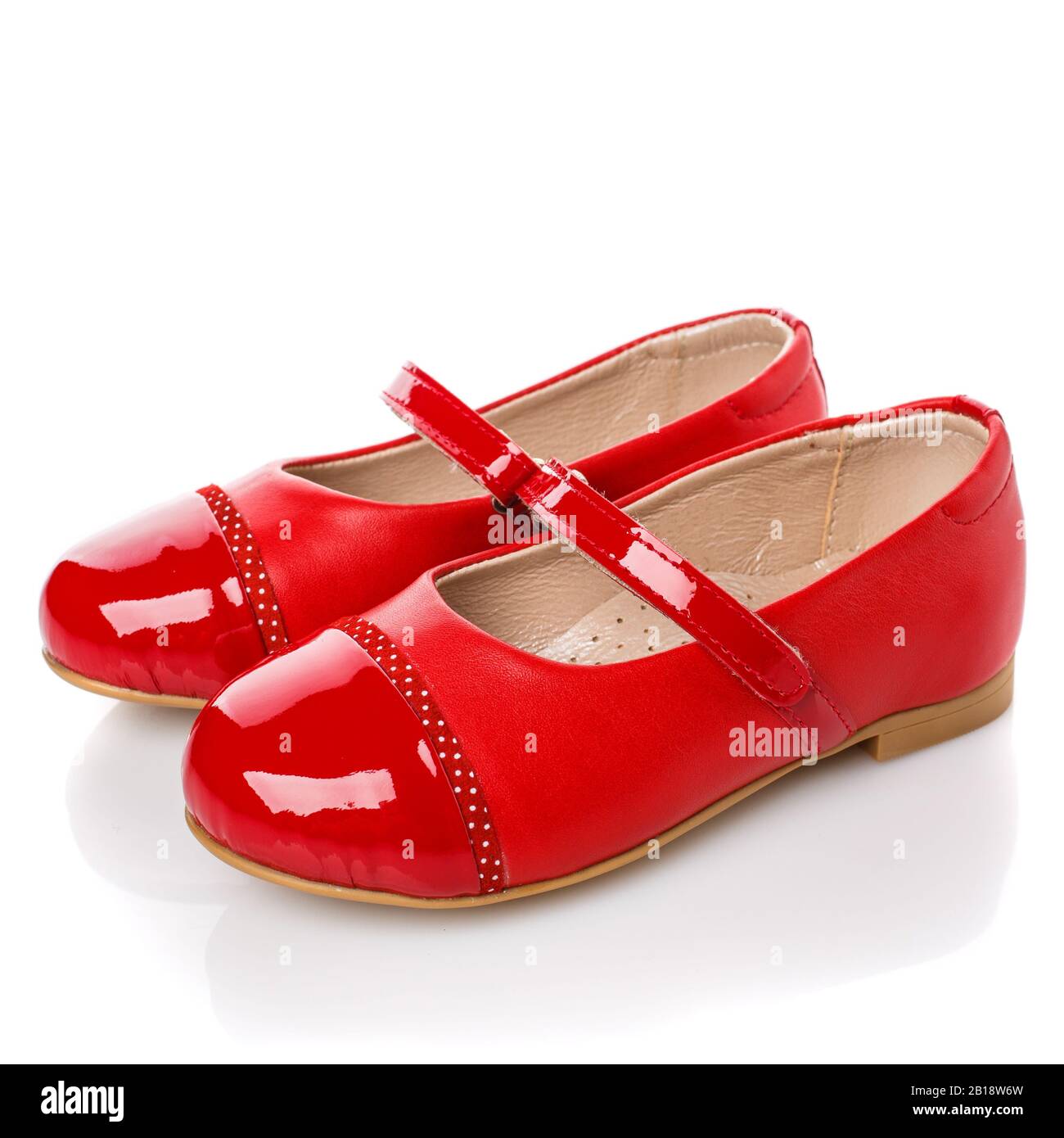 Children's red leather shoes for girls. isolated on white. Side view ...