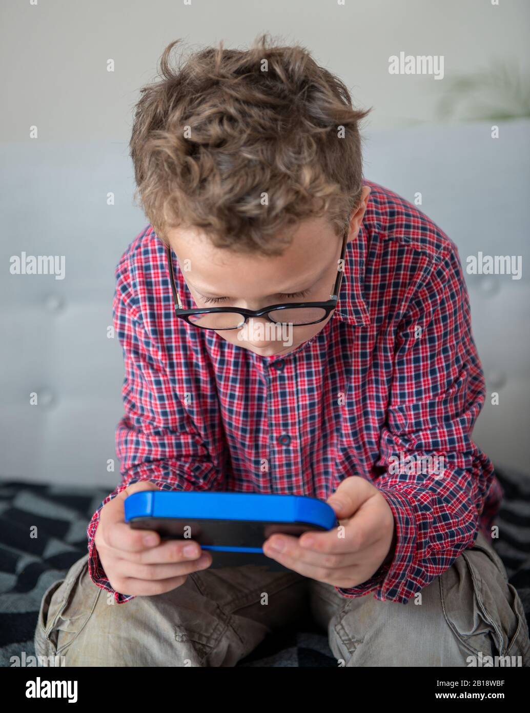 child boy playing with video game Stock Photo - Alamy