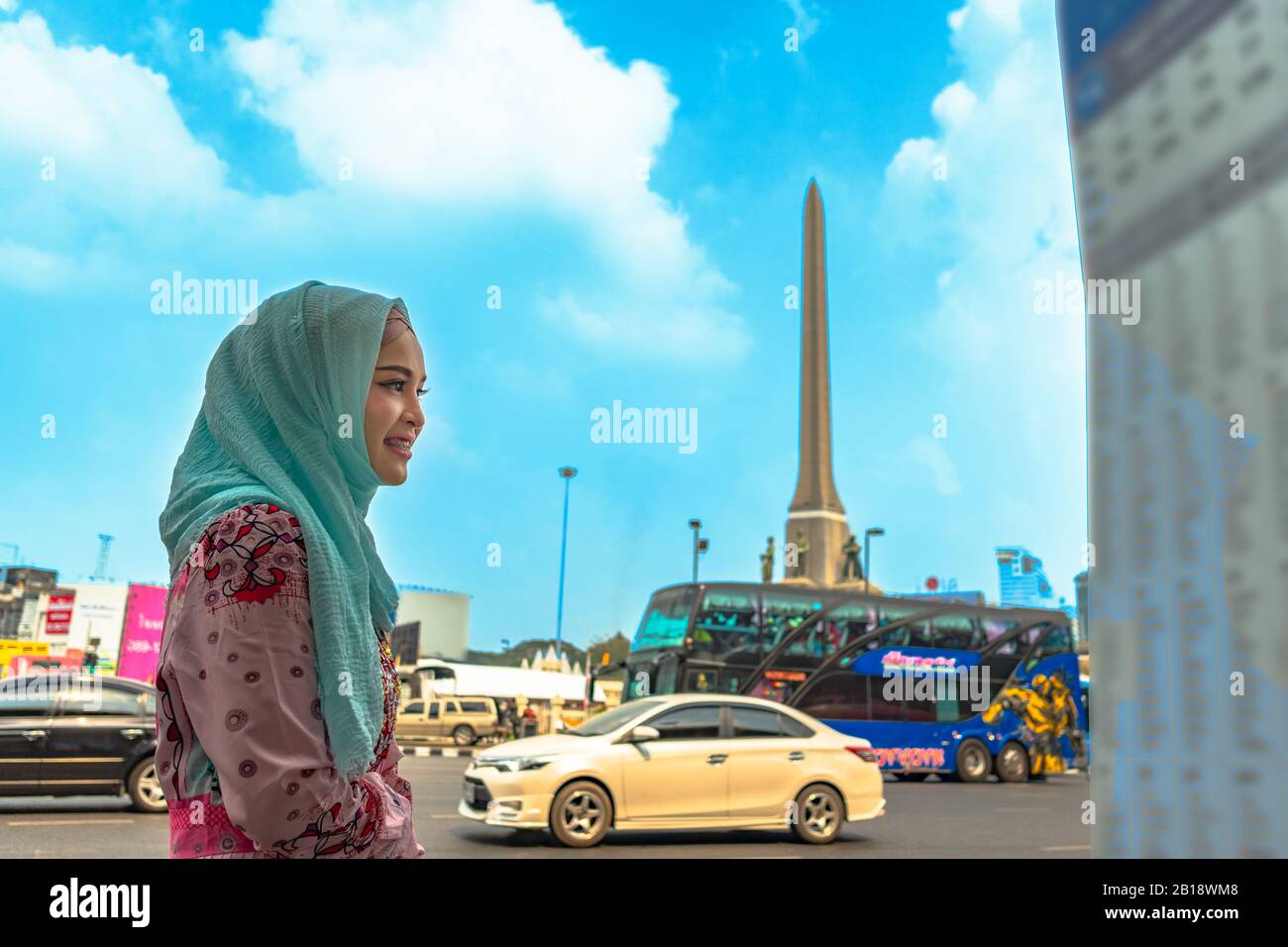 Islam lady waiting for a bus at bus stop at vctory monument Stock Photo ...