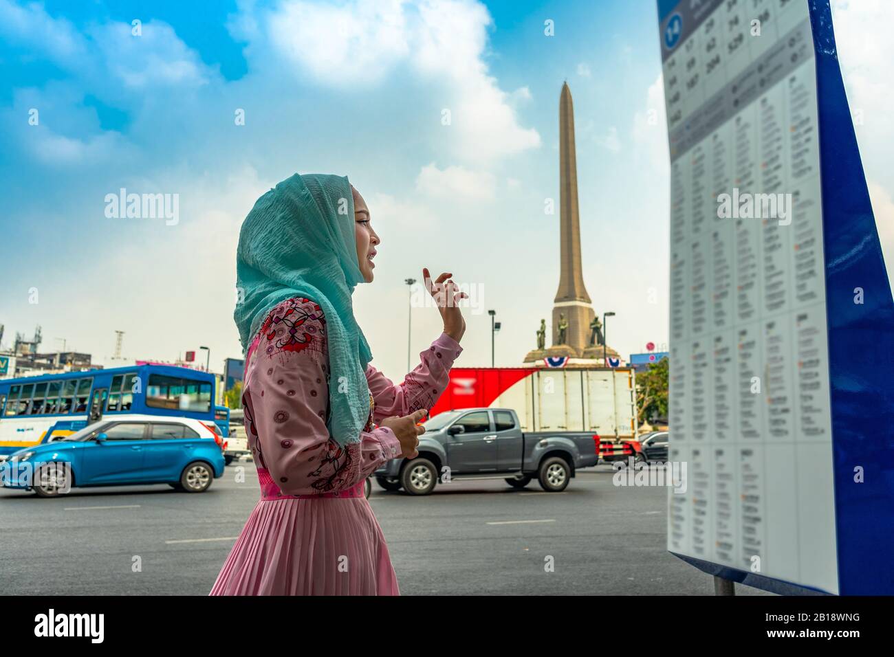 Islam lady waiting for a bus at bus stop at vctory monument Stock Photo ...