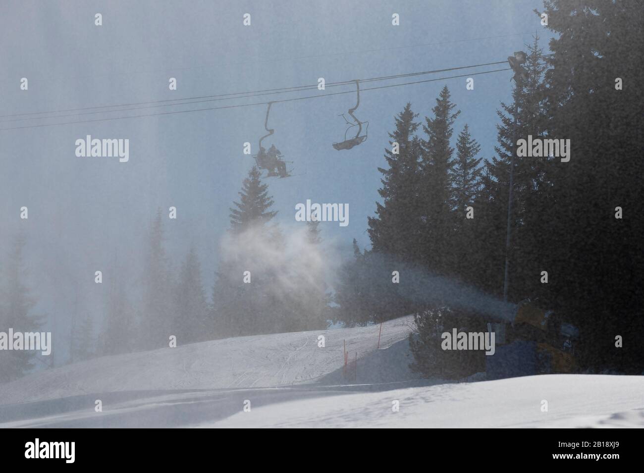Ski slope with artificial snow machine Stock Photo - Alamy