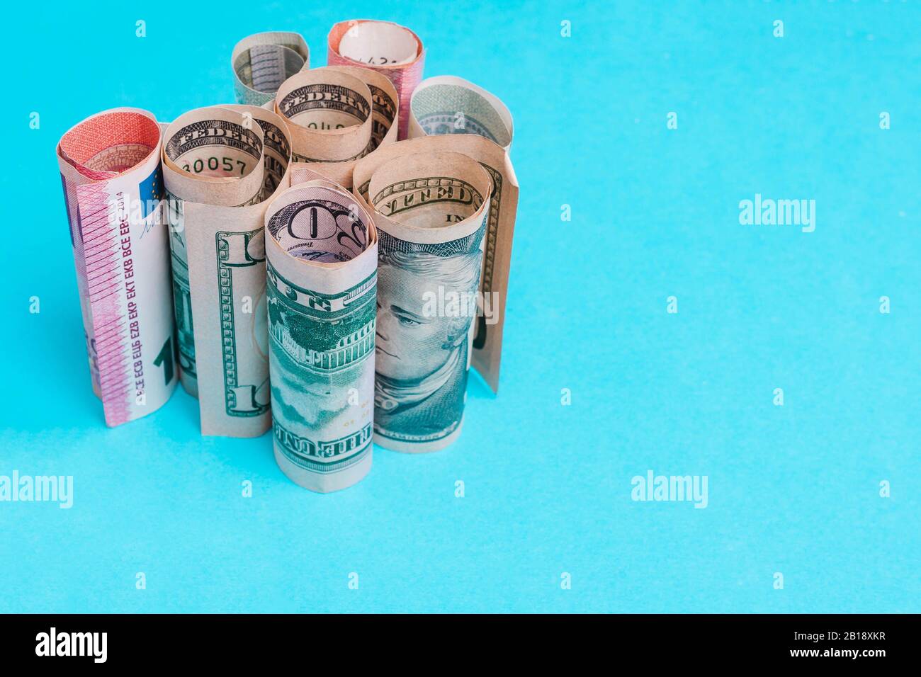 Dollar bills and dollars banknotes on a blue background Stock Photo - Alamy
