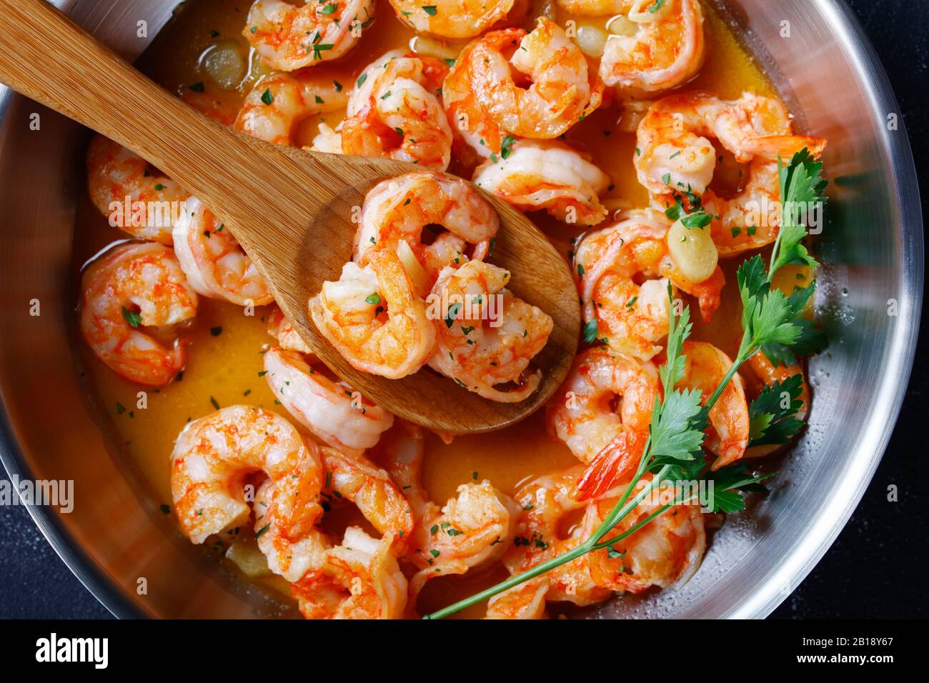 Italian shrimp scampi with garlic butter sauce served with lemon and ...
