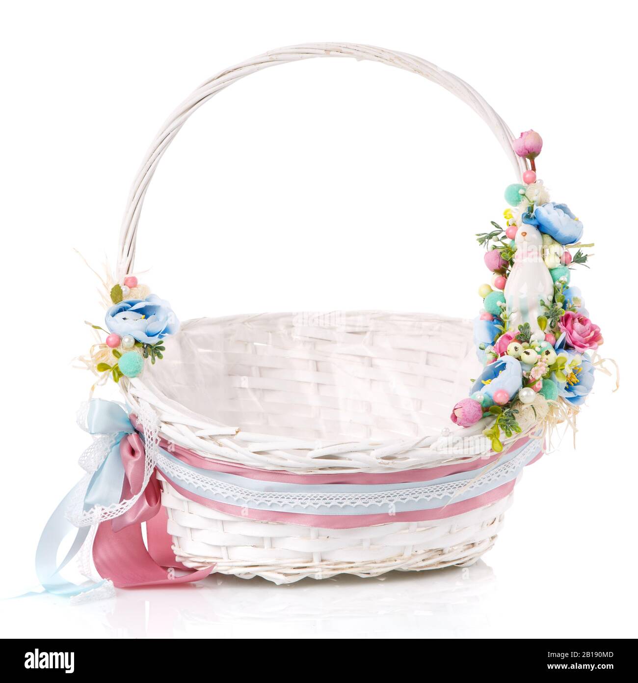 Wicker basket with floral decor and ribbons on white background Stock ...