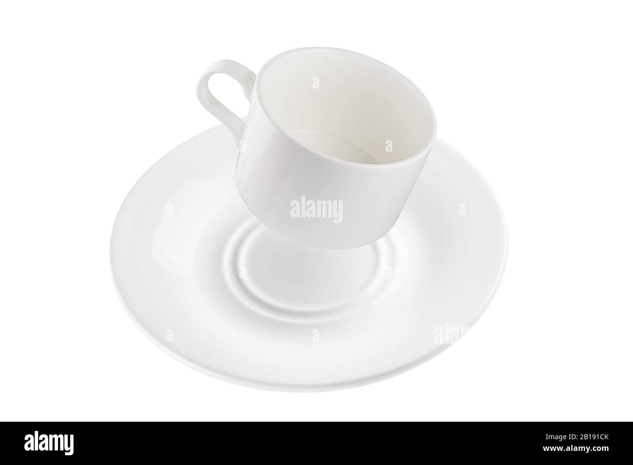Coffee mug and saucer in the air at an angle. Full depth of field ...