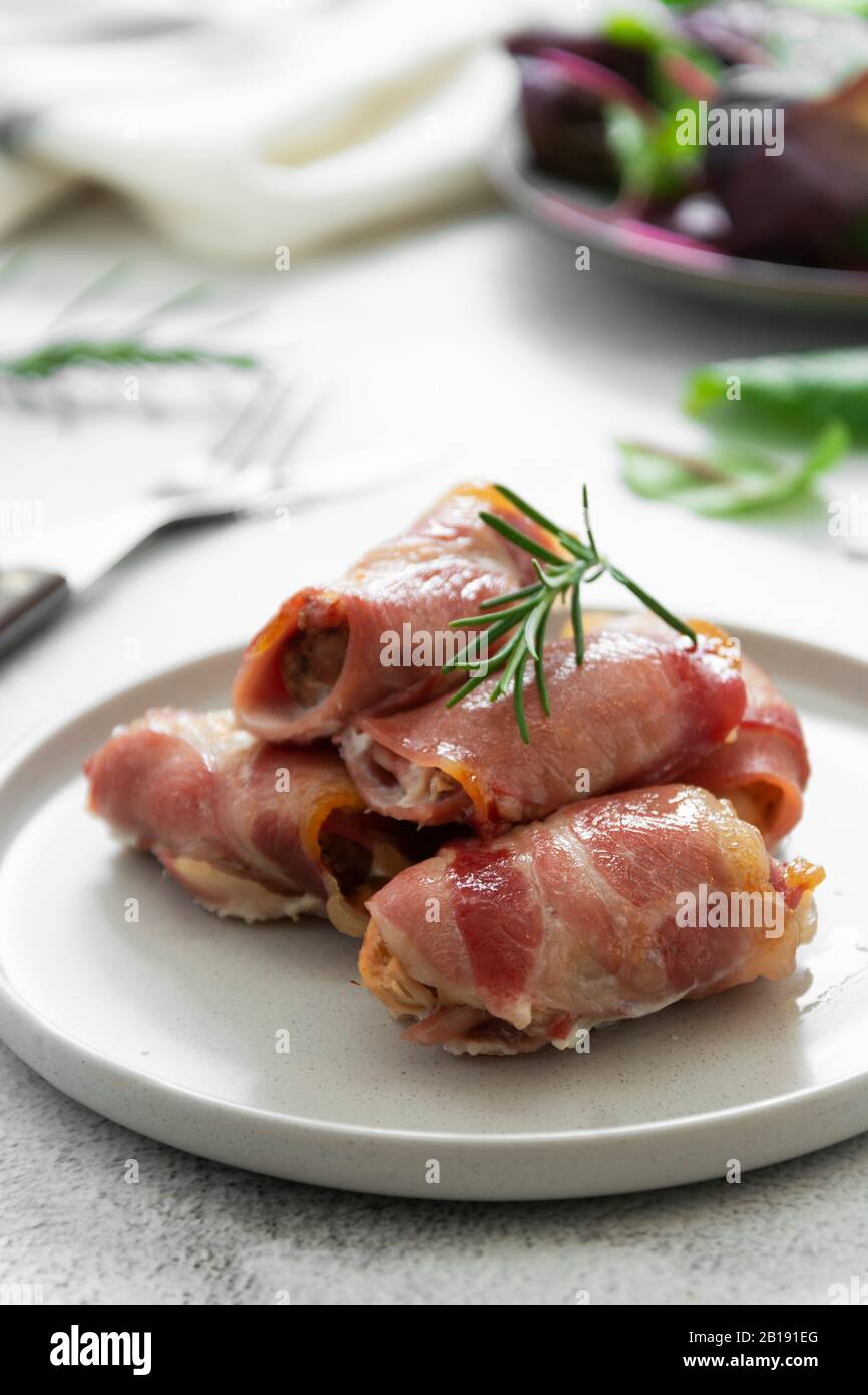 Delicious pigs in blankets, meat wrapped in bacon, homemade cooked meat ...