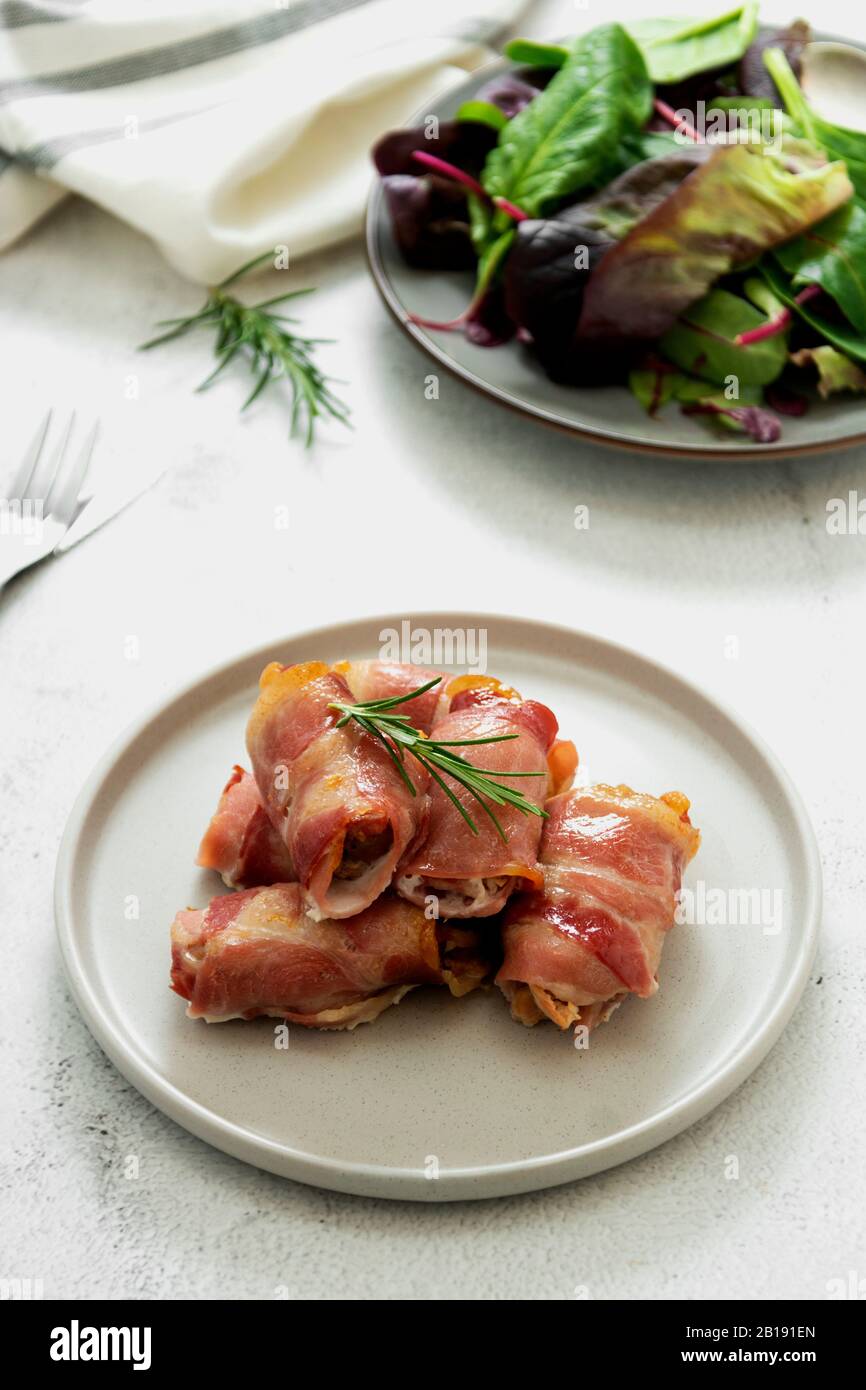 Delicious pigs in blankets, meat wrapped in bacon, homemade cooked meat ...