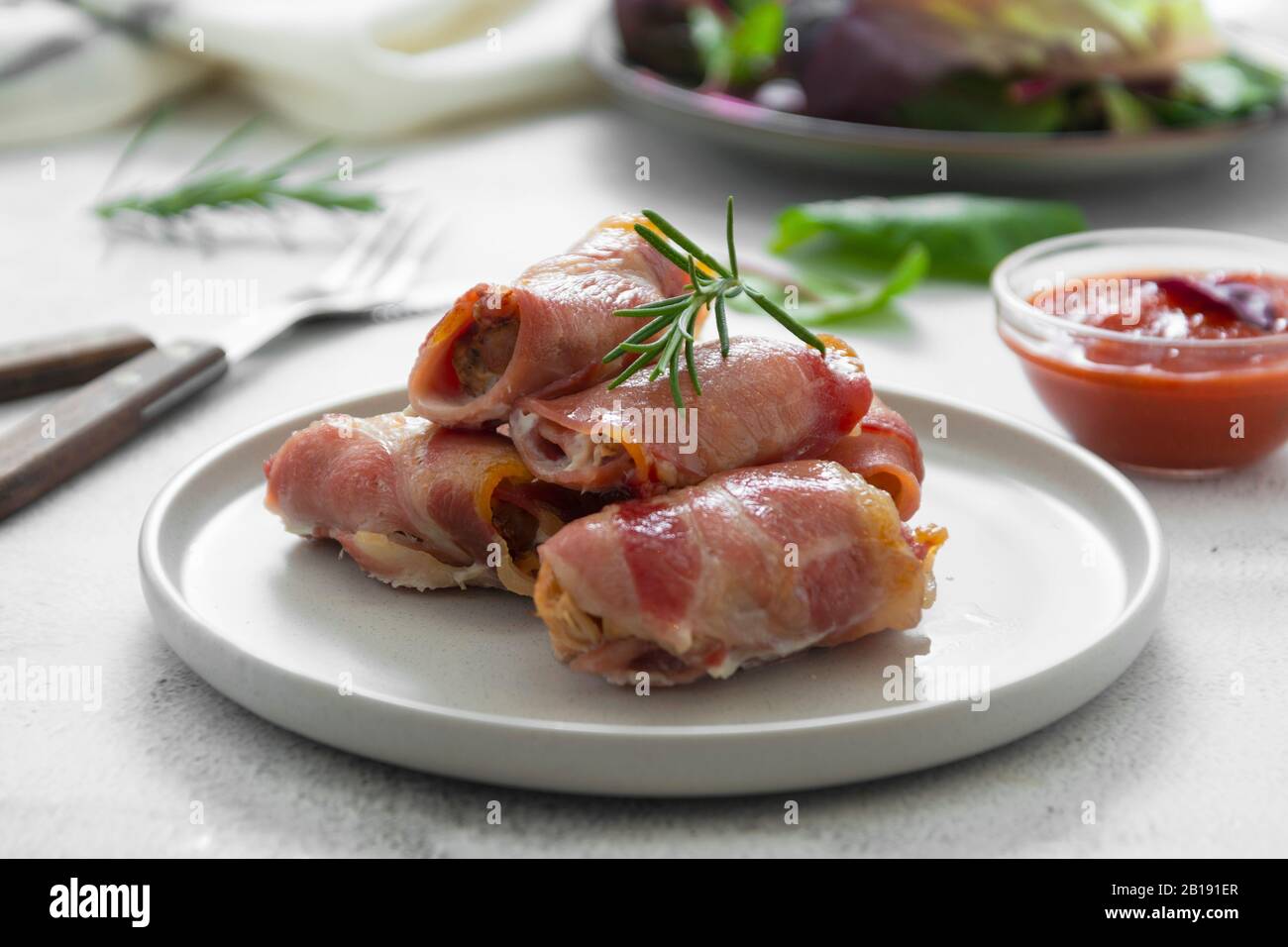 Delicious pigs in blankets, meat wrapped in bacon, homemade cooked meat ...