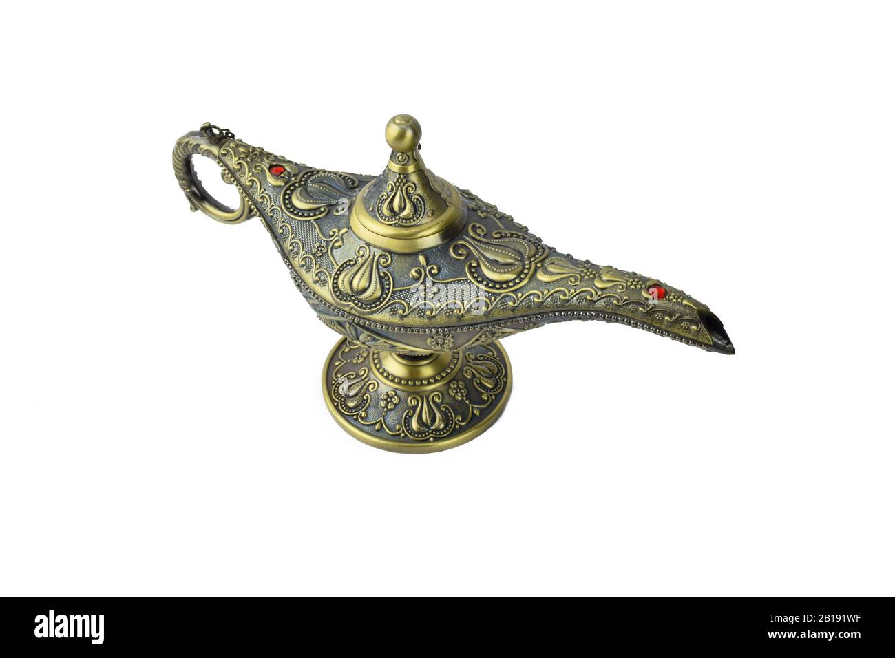 Top view of an antique golden colored decorated oil lamp on a white ...