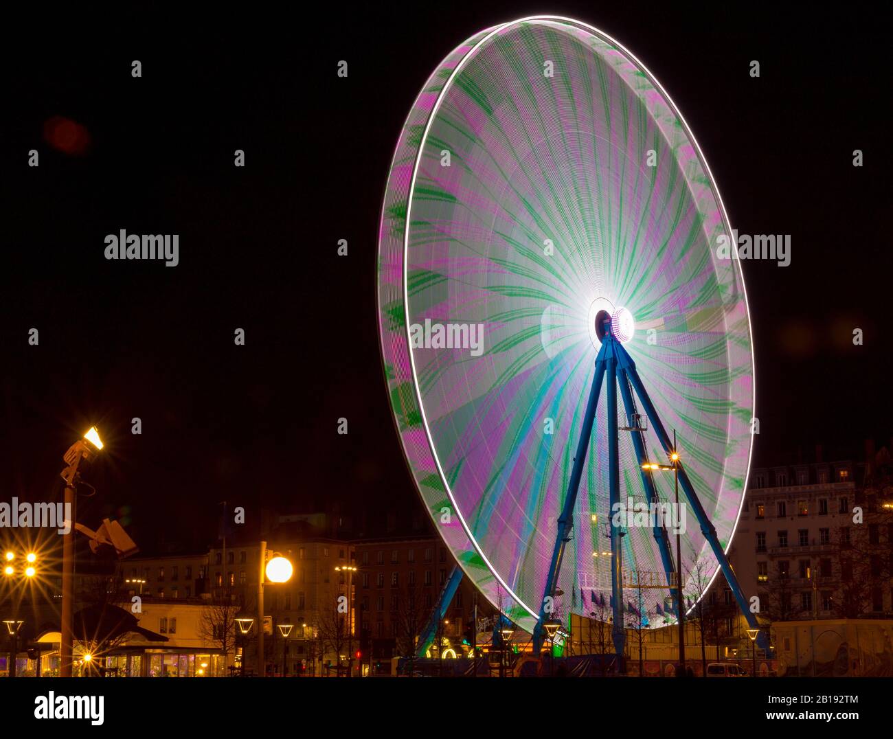 Show on the big multicolored wheel of Bellecour square. The Festival of ...