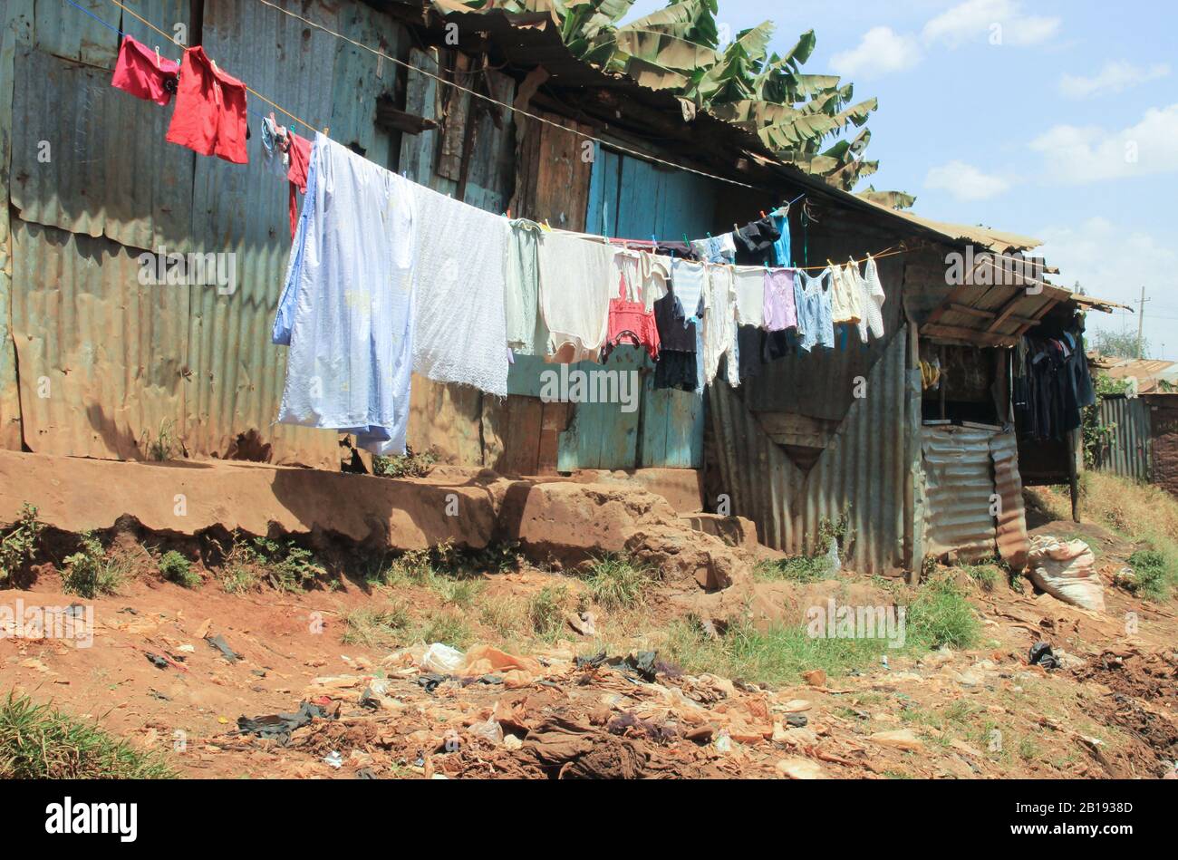 clothes are drying on ropes in the slums of Nairobi - one of the ...