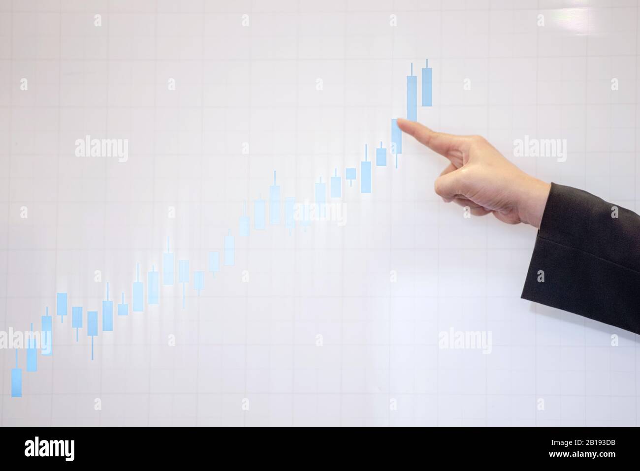 Business hands pointing a presentation board with the financial chart ...