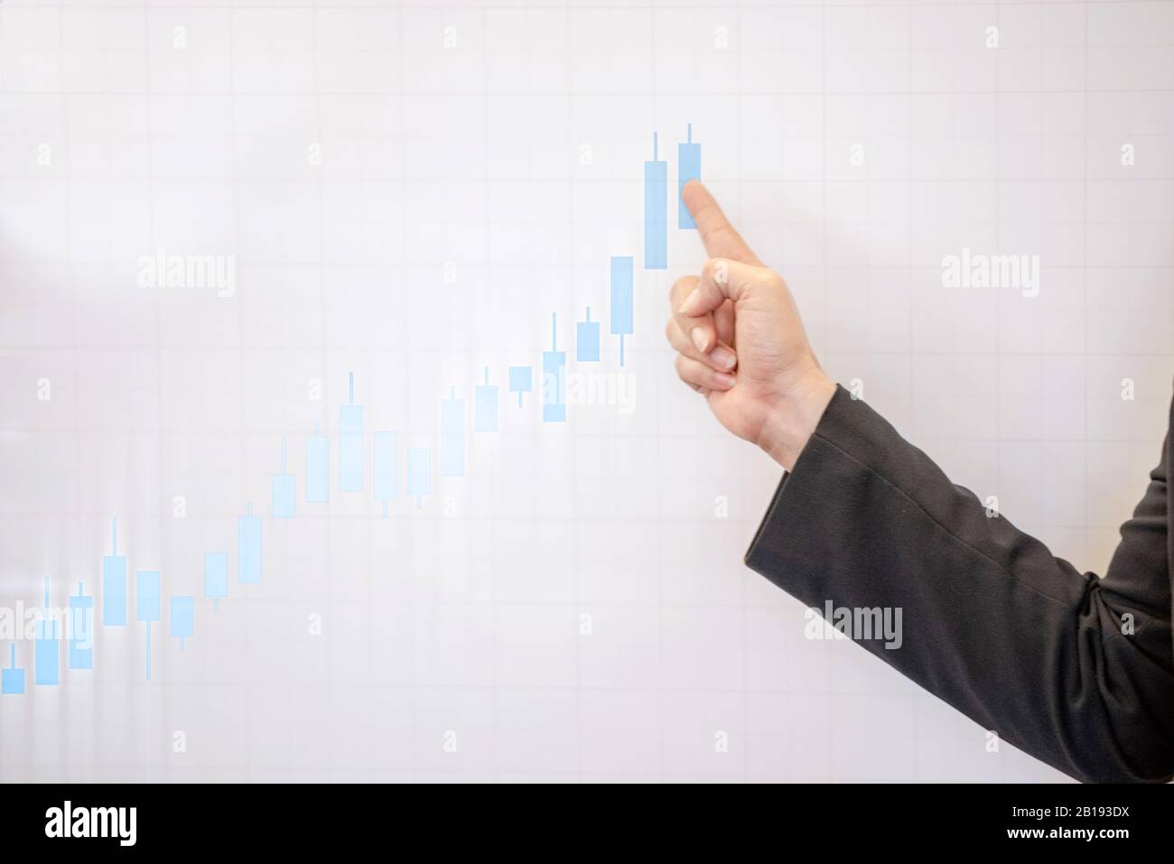 Business hands pointing a presentation board with the financial chart ...