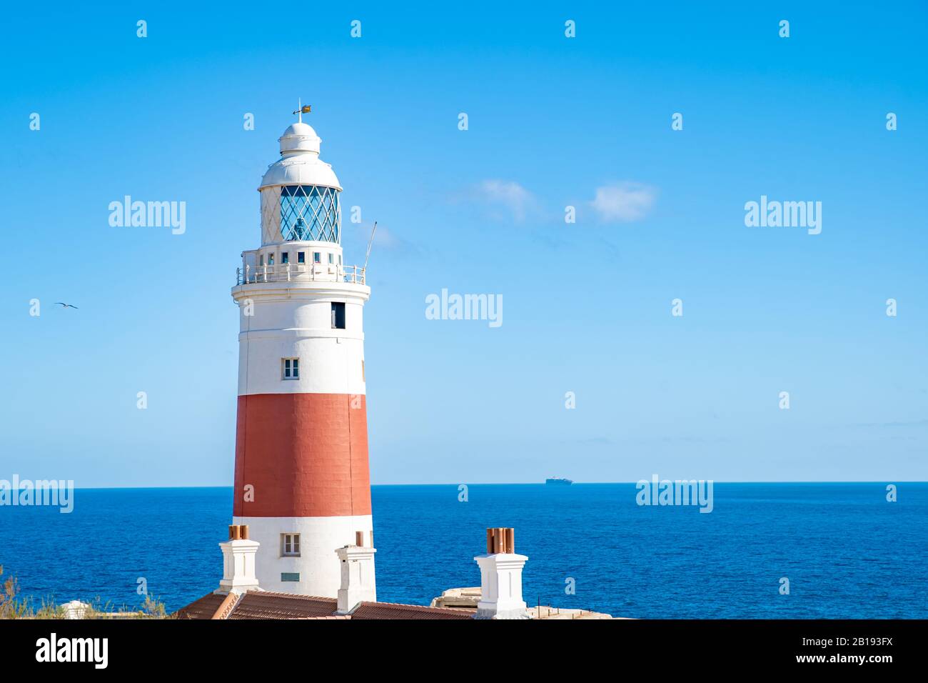a lighthouse on the coast of the ocean serves to indicate the direction ...