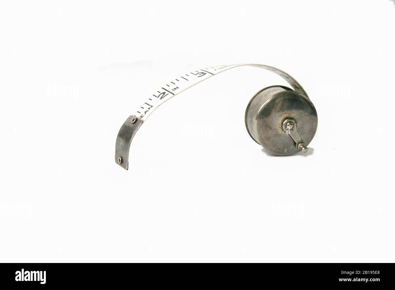 Antique silver holder for measuring tape Stock Photo - Alamy