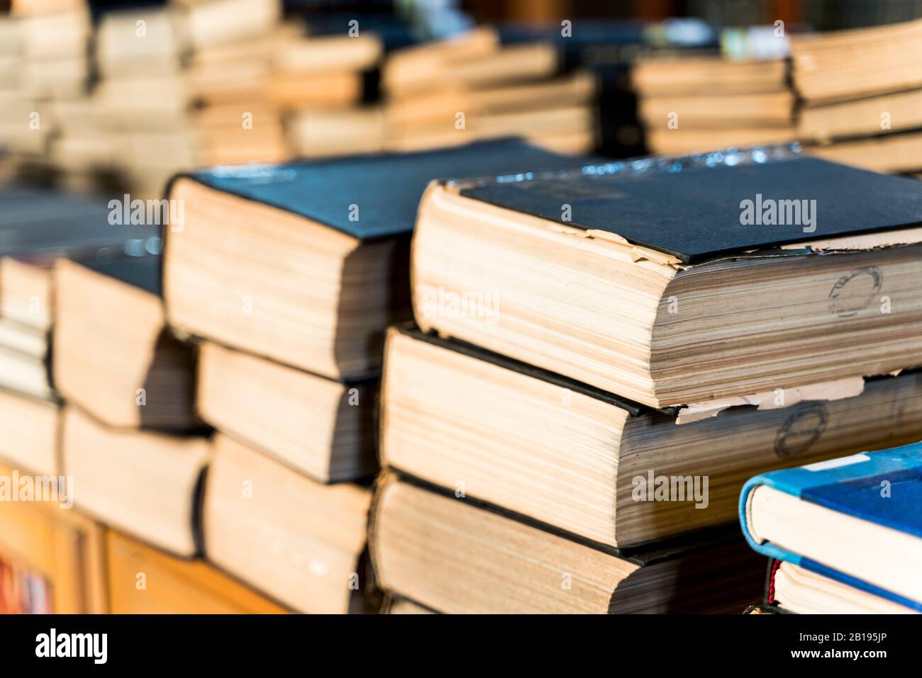 Old books background. No labels, blank spine Stock Photo - Alamy