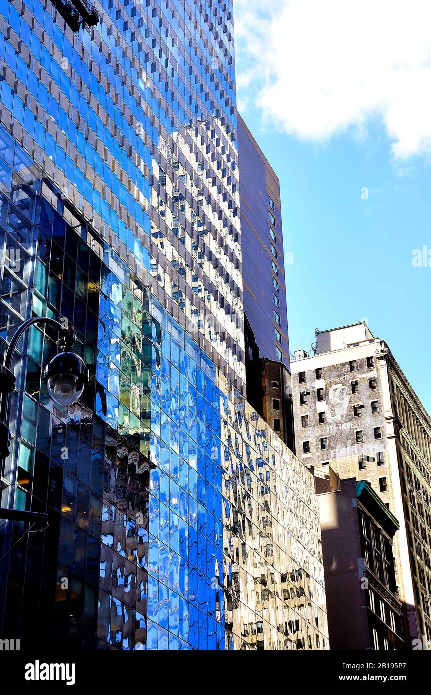 Wrapped in textureless panels that reflect their surroundings and allow ...