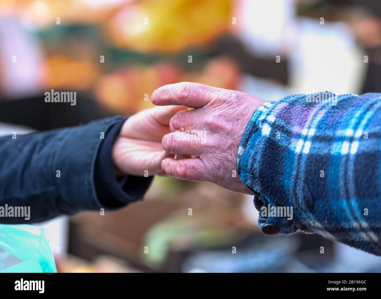 Hand out handing hi-res stock photography and images - Alamy