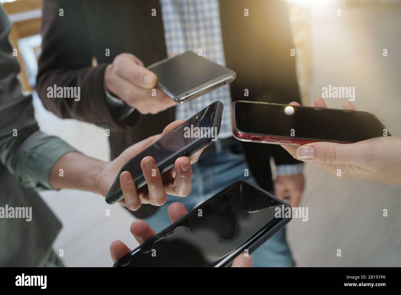 Cellphones hands up hi-res stock photography and images - Alamy