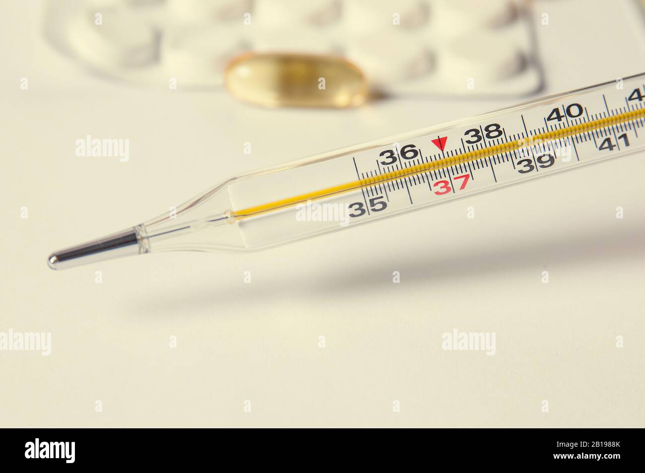 Thermometer and pills. A set of medicines on a white background Stock ...