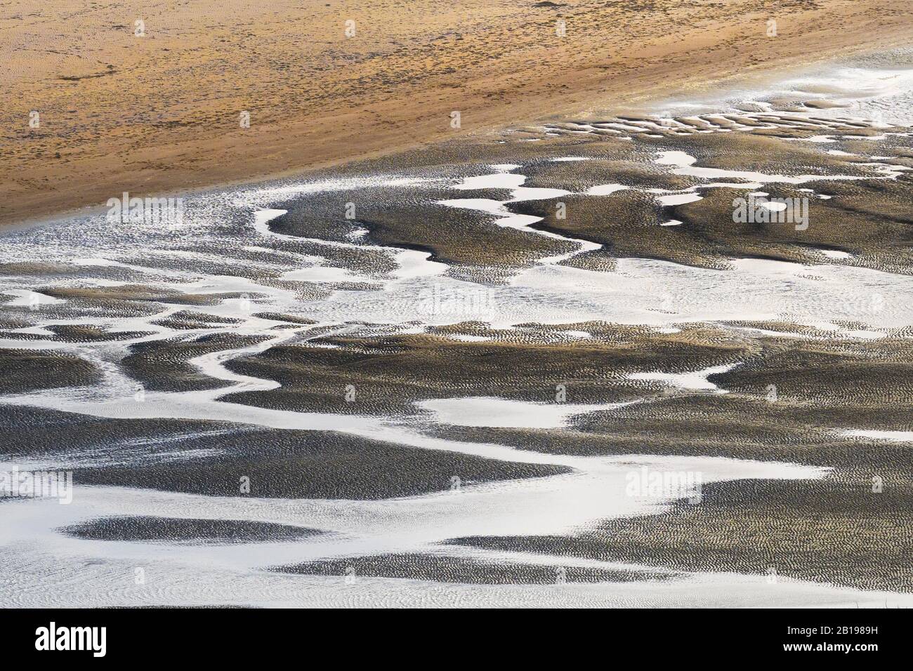 The sea bed exposed by an extremely low spring tide at Crantock Beach ...