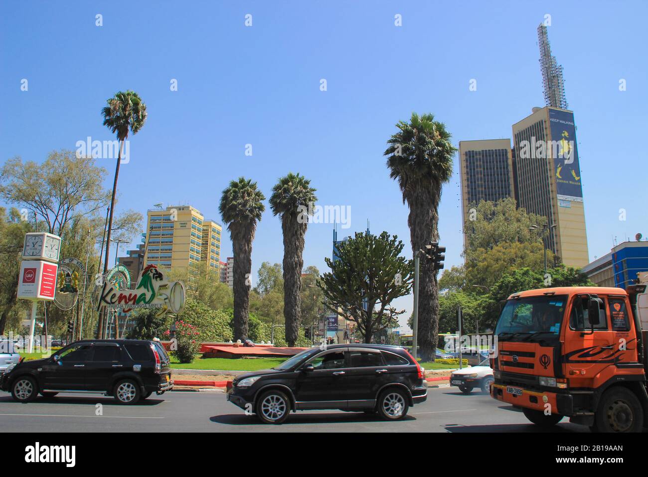 Nairobi, Kenya - January 17, 2015: downtown by day. Buildings, palm ...